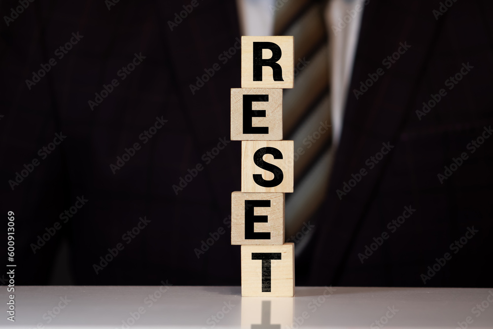 White tile alphabet letter with word reset on wood background Stock ...