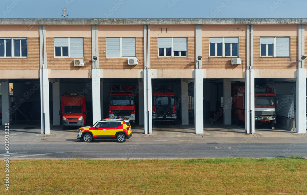 Fire station with fire trucks inside. Stock Photo | Adobe Stock