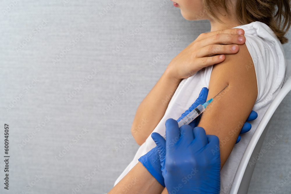 vaccination of children, a little boy at a doctor's appointment, an ...