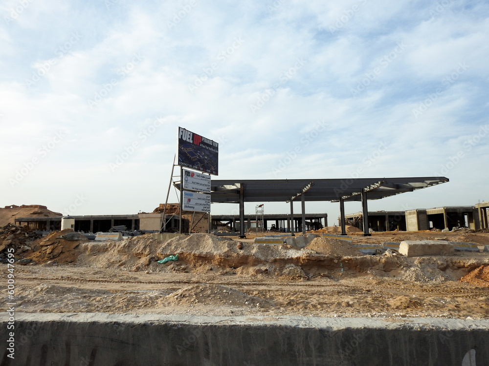 Giza, Egypt, May 4 2023: Fuel up gas and oil station under construction ...
