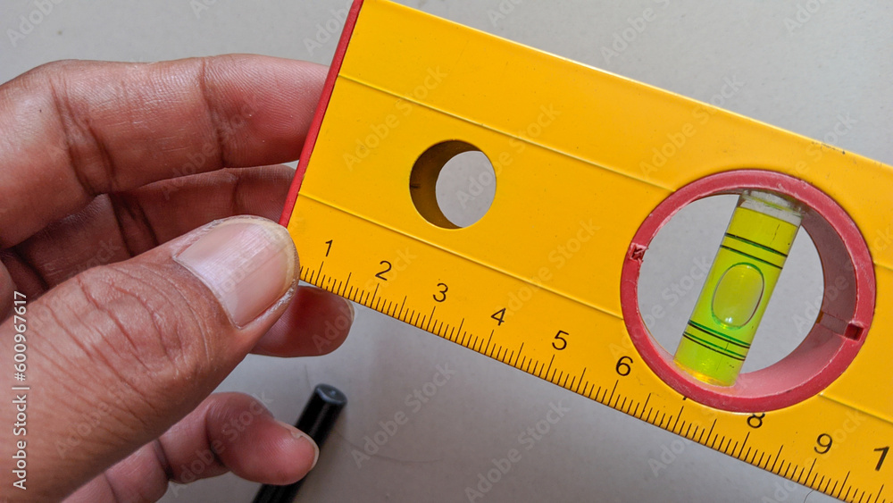 Ruler and water level meter. Used to measure the difference in height ...
