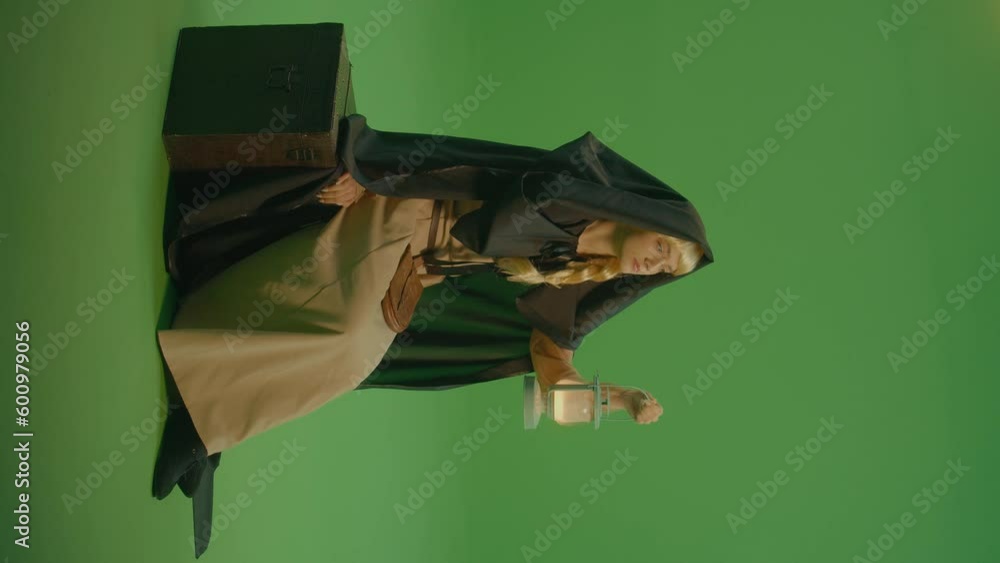 Vertical View. Green Screen. A Woman Sorceress in a Cloak With a Hood ...