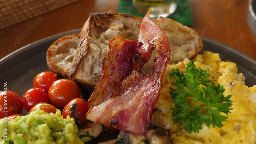 Nutritious breakfast on plate, close up dolly-like shot, shallow focus ...