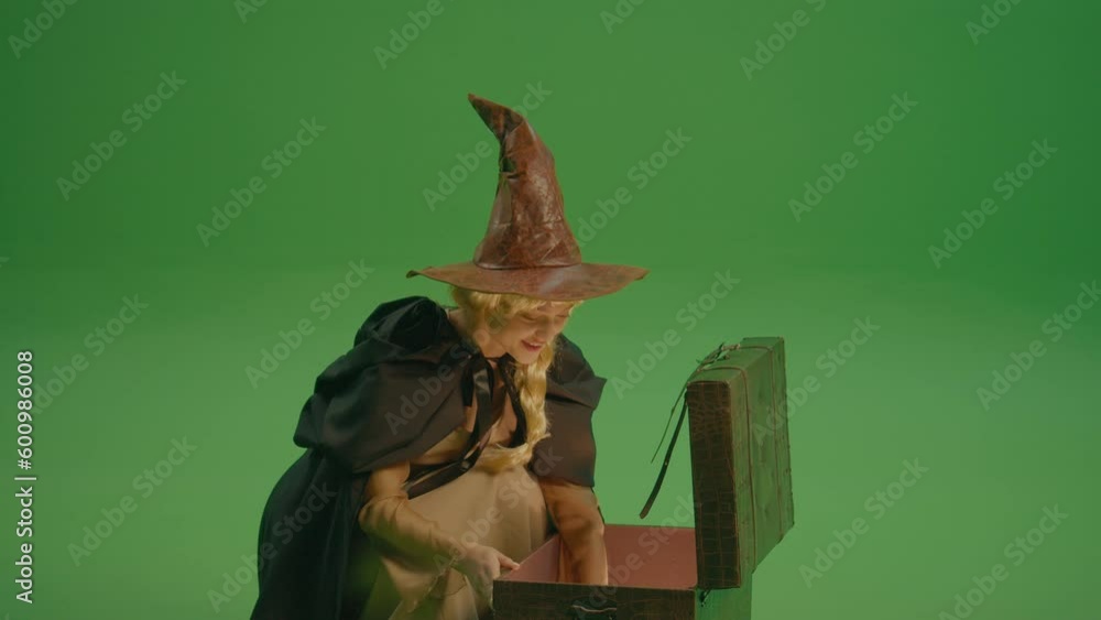 Green Screen. A Magical Girl in a Medieval Dress Opens a Magic Chest ...