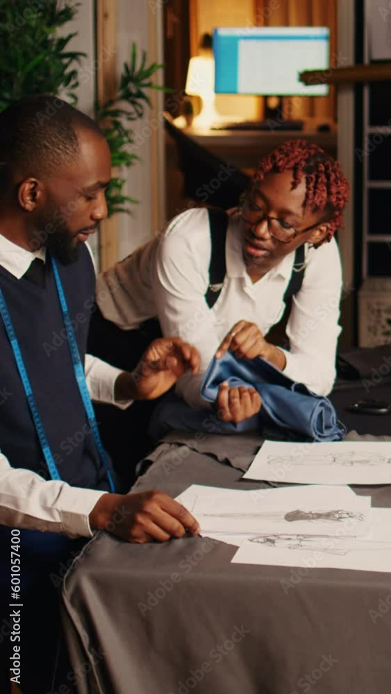 Vertical video African american tailors picking fabric to create luxury ...