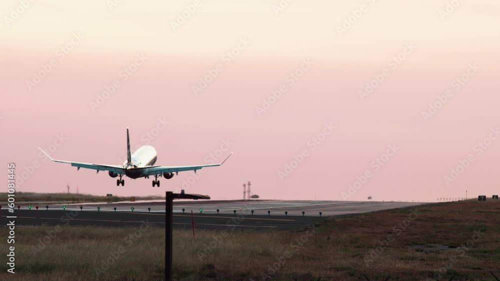 Jet plane landing in silhouette. Tracking shot of airplane landing at ... Jet plane landing in silhouette. Tracking shot of airplane landing at ...