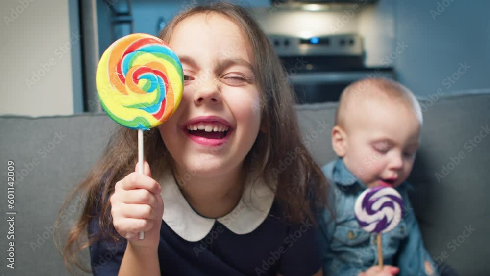 Kids With Lollipop. Two Happy Cheerful Children Eat Candy on a Stick at ...