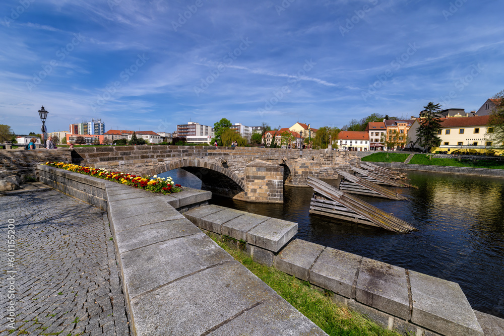 Historic stone bridge over river Otava in medieval town Pisek (Southern ...