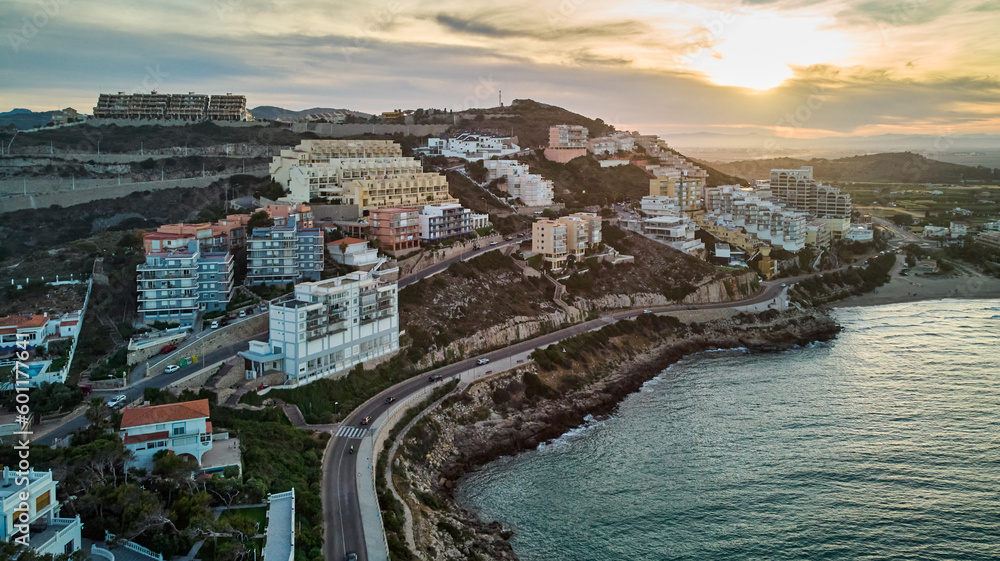 Bustling city on a cliff overlooking the ocean. Aerial view of the ...