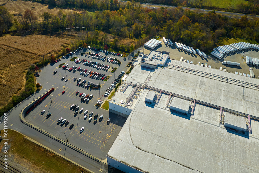 Aerial view of many employee cars parked on parking lot in front of ...