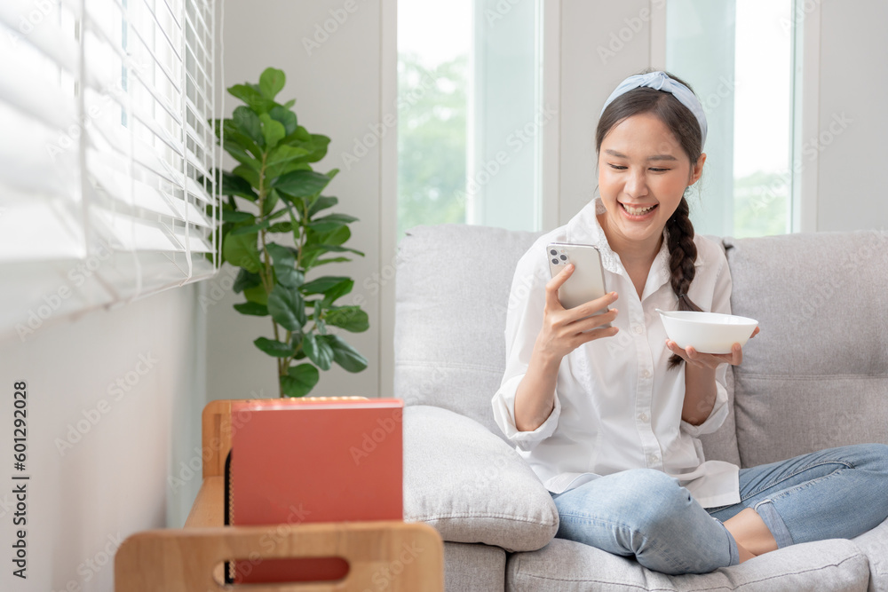 asian beautiful girl smiling happily. use mobile phone for social media ...