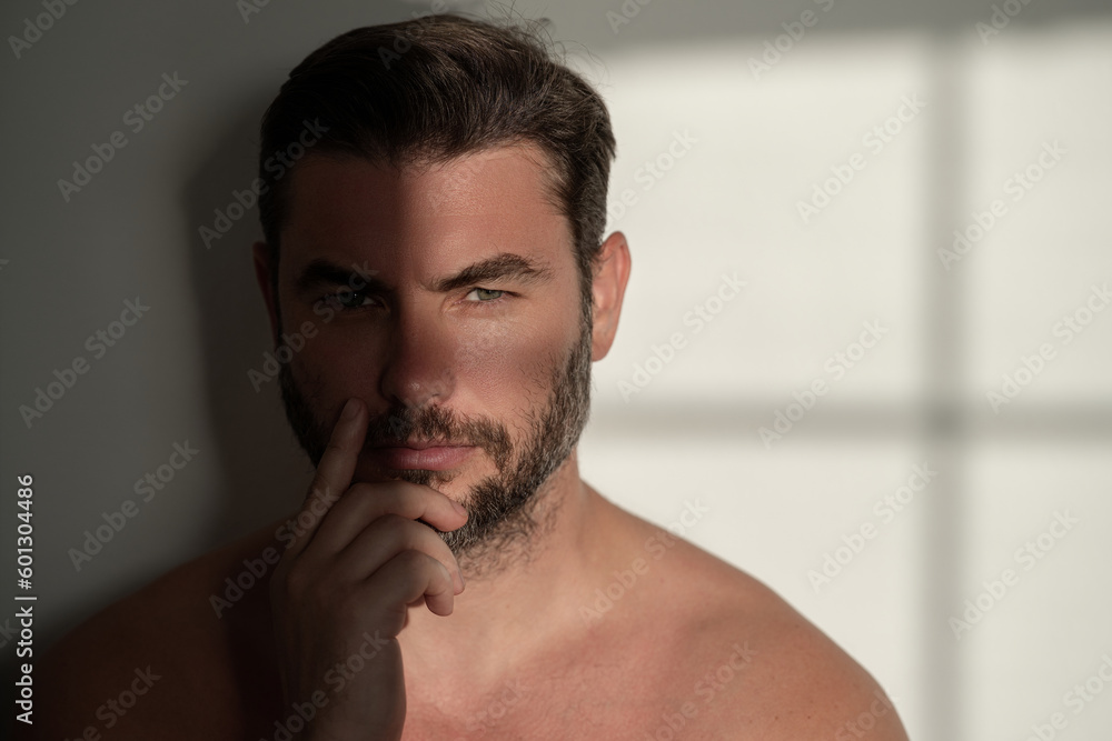 Beauty close up portrait of handsome man with moisturizing cream on ...