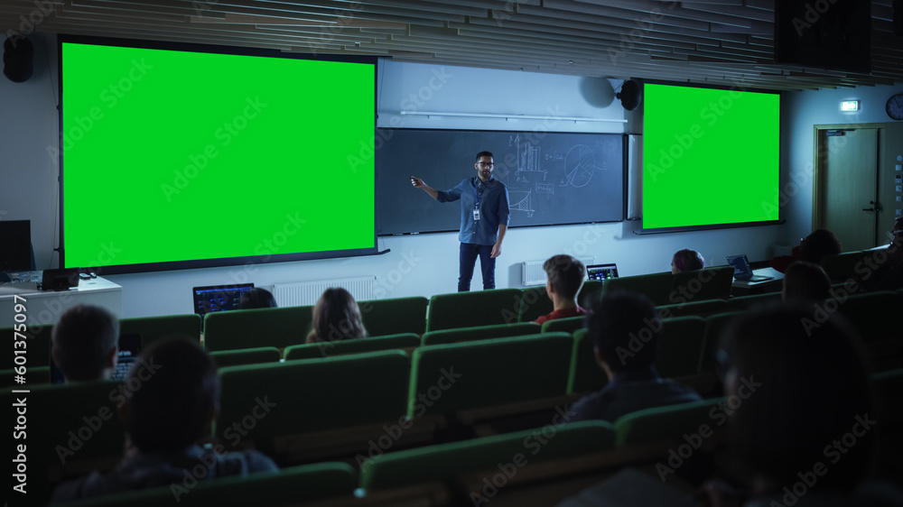Young Male Teacher Giving a Lecture, Showing Slides on a Green Screen ...