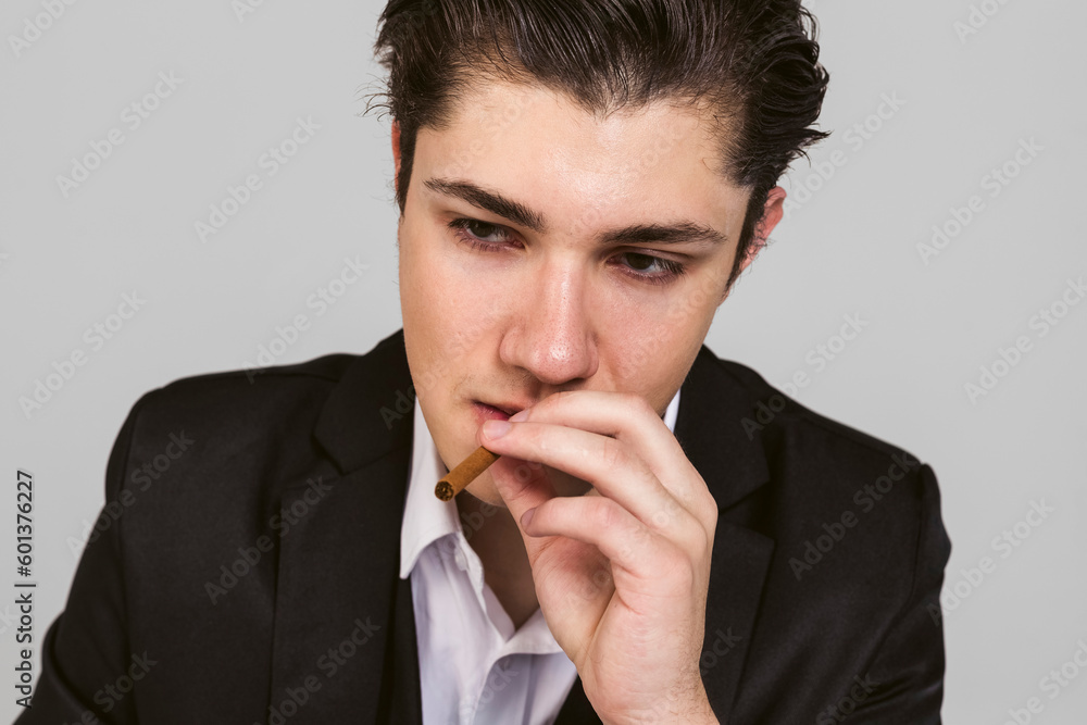 Portrait of a young mafia member with a slicked back hair, dressed in ...