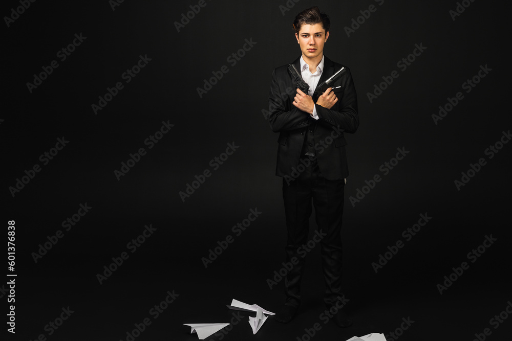 Young mafia member with a slicked back hair, in black suit, cigar ...