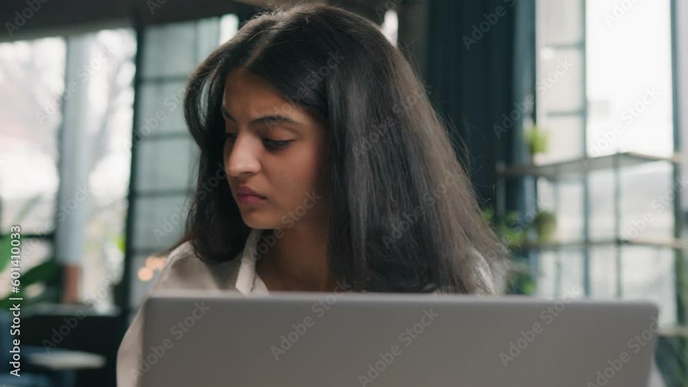 Indian anxious woman with computer working business problem in office ...