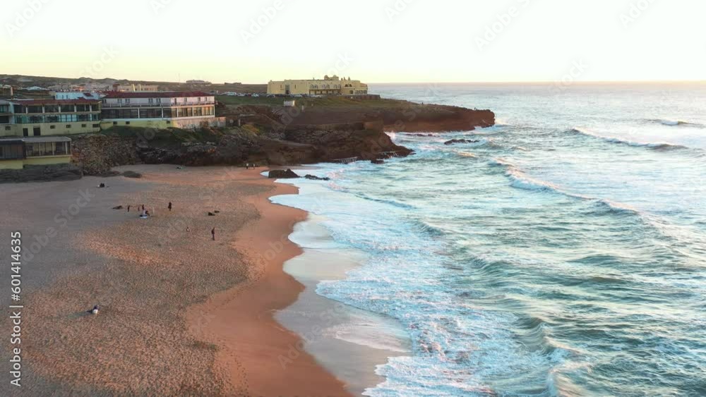 Fly over ocean at sunset. Hotel on Atlantic ocean beach in Portugal ...