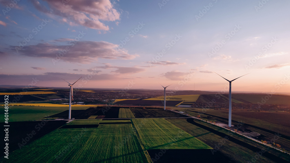 Windmill turbines generating green energy electric.Green energy helps ...