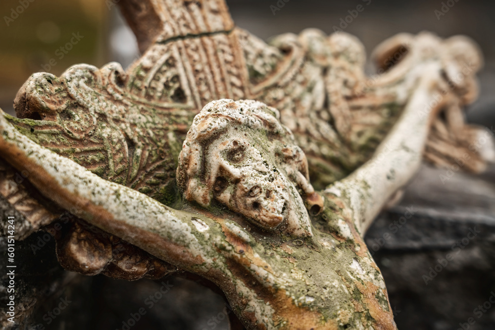 Ancient stone sculpture of Jesus Christ, crucified on a cross. Cross in ...