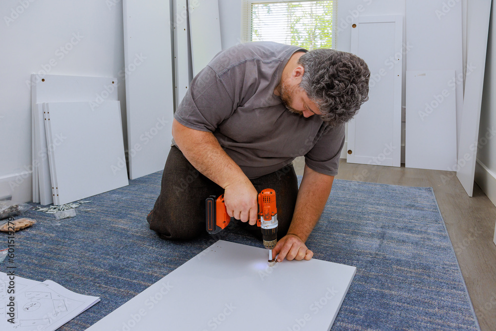 Handyman is currently assembling and installing furniture closet ...