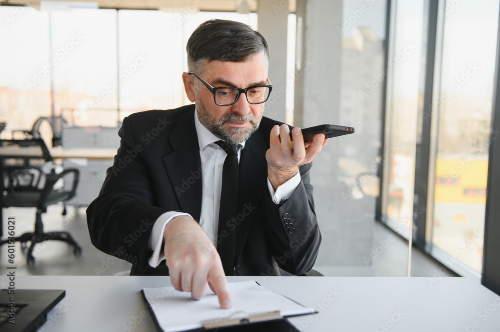 Experienced executive manager quarreling with employee on mobile ...