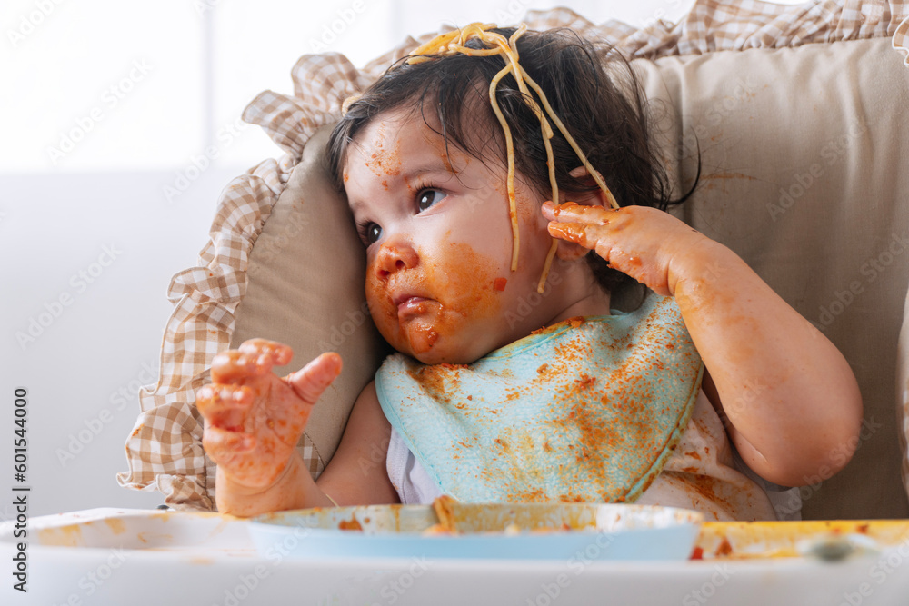Unhappy sad toddler child messy tomato sauce on mouth crying. Upset ...