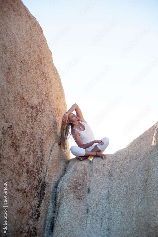 Beautiful yogini with long blonde hair experiencing yogic Shakti in the ...