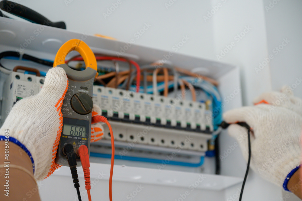 Electrical measurements with a multimeter tester. industrial ...