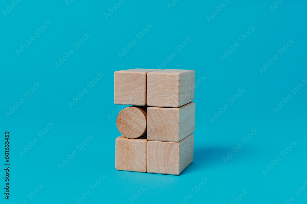 cylindrical toy block between square toy blocks Stock Photo | Adobe Stock