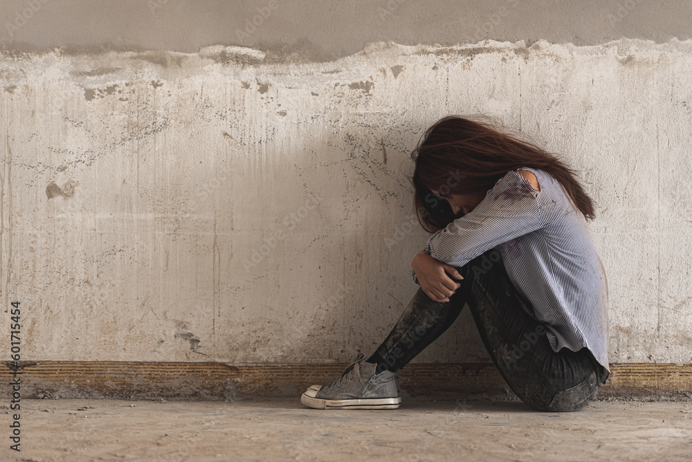 depression sad alone woman sit in dirty abandon building after raped ...