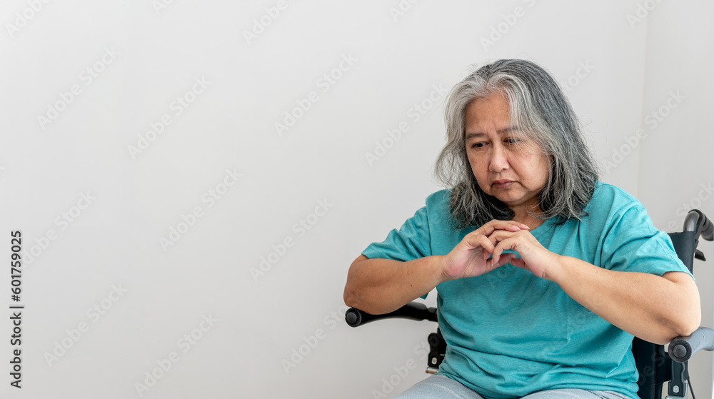 Asian Elderly Woman Sitting In Wheelchair She Is Sad And Anxiety From