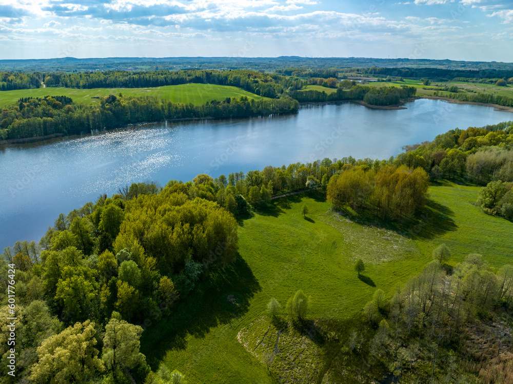 Beautiful drone nature landscape of fields, meadows, forest and lake ...