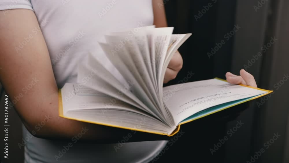 Vidéo Stock Close up, Unrecognizable Boy Flipping through Pages of a ...