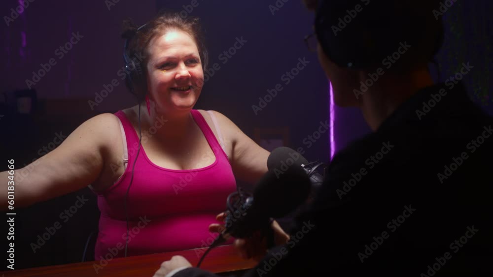 Podcast about body positivity. Chubby fat woman speaks into the ...