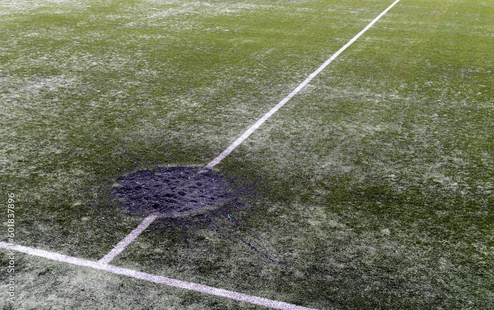 A hole in the ground from a cannon shell explosion filled with fresh ...