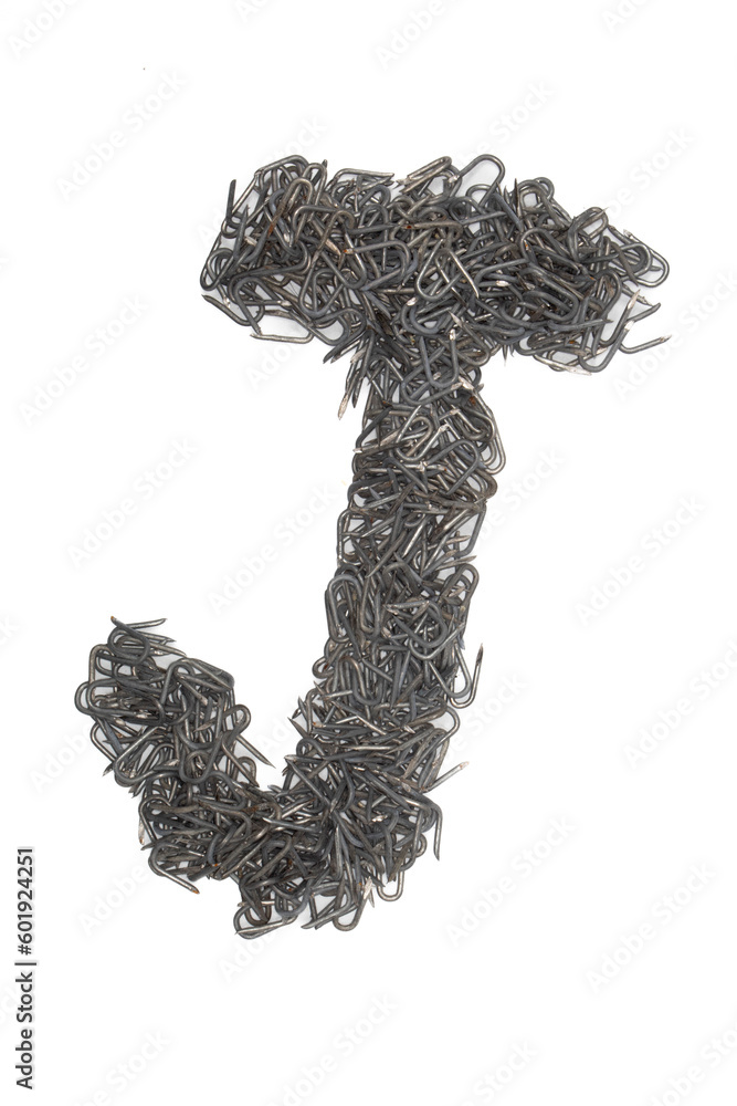 artistic isolated Letter J made from steel staples isolated on a white ...