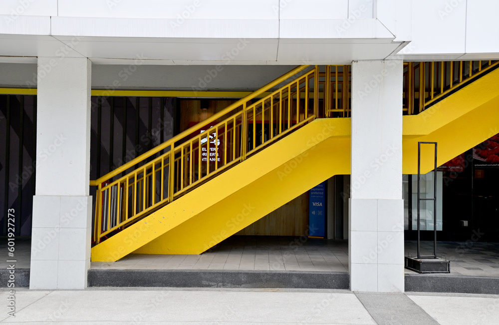 BANGKOK, THAILAND - MAY 12, 2023 : Yellow cement steps and yellow iron ...