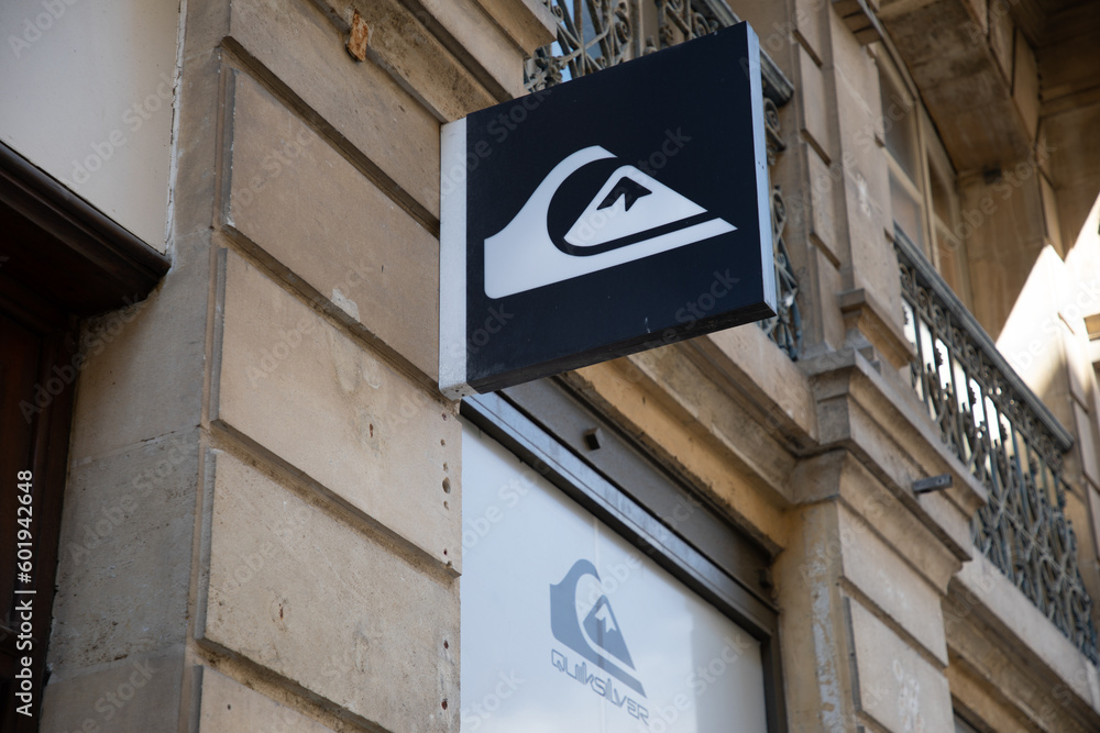Quiksilver sign text and shop brand logo front of entrance wall store ...