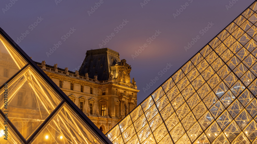 Paris, France, April 2023. The Louvre glass Pyramid at Night ...