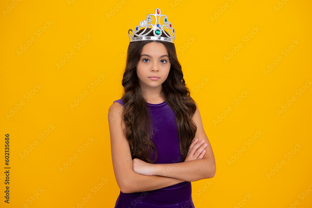 Little queen wearing golden crown. Teenage girl princess holding crown ...