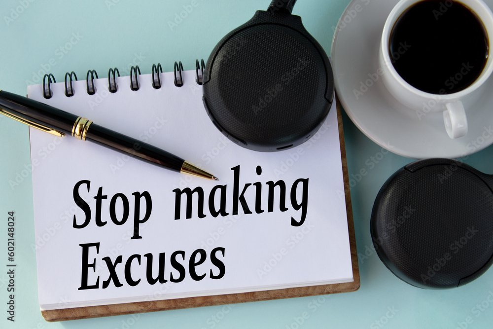 STOP MAKING EXCUSES - words in a white notepad on a light background ...