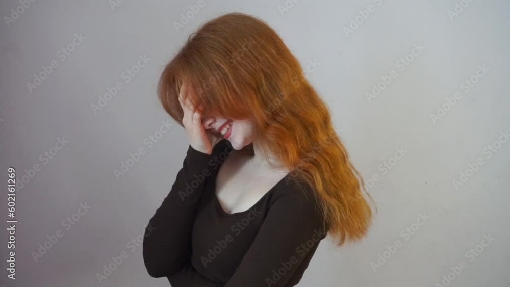 facepalm, shame, mockery, laughter, redhead girl laughs and covers her ...