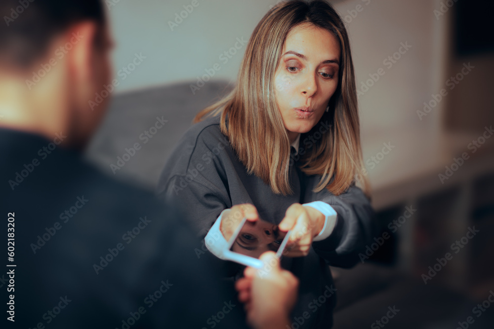 Foto de Girlfriend and Boyfriend Fighting Over a Phone Device out of ...