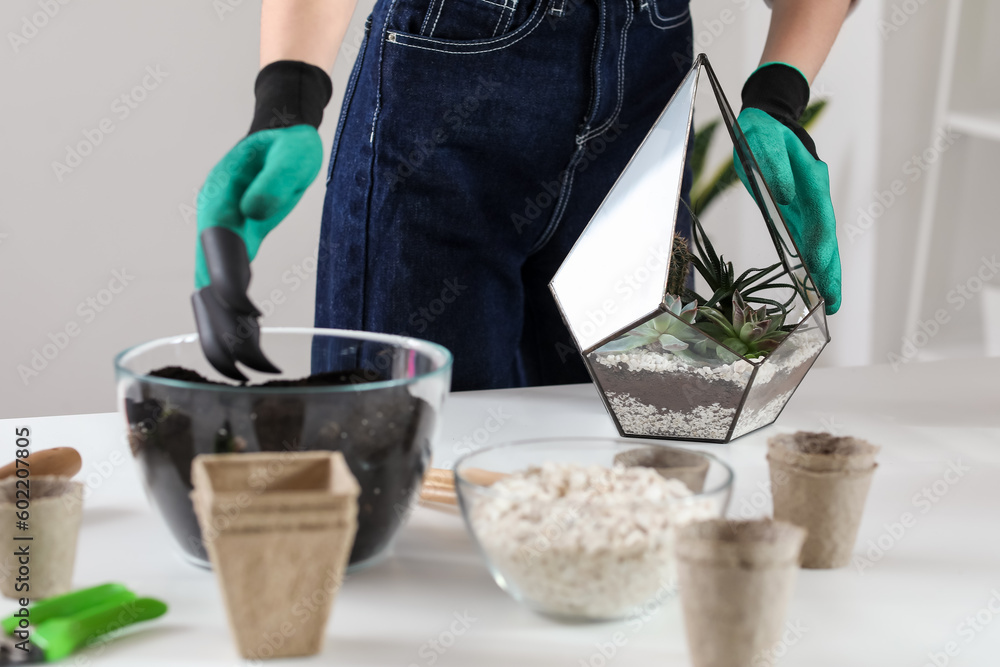 Woman making florarium at table, closeup Stock Photo | Adobe Stock