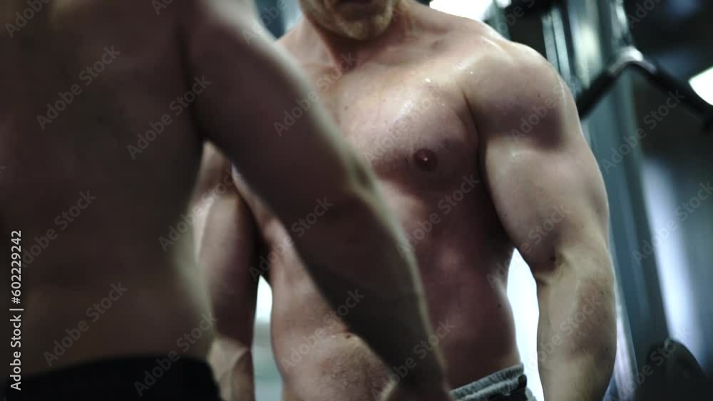 Raising the bar - two bodybuilders perfect their form and technique to build impressive muscles ...