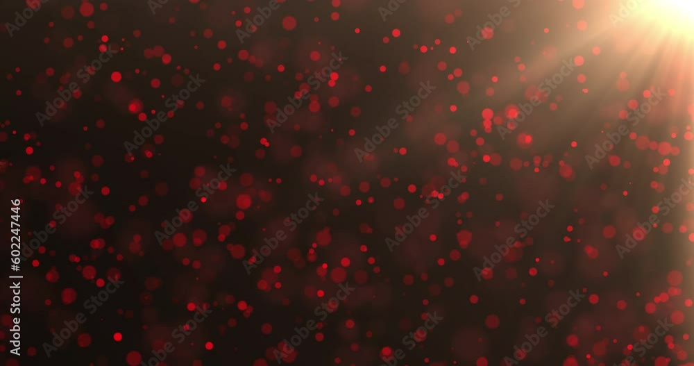 Red luxury bokeh on particles floating in the air. Dust and glitter particles backgrounds. Black ...