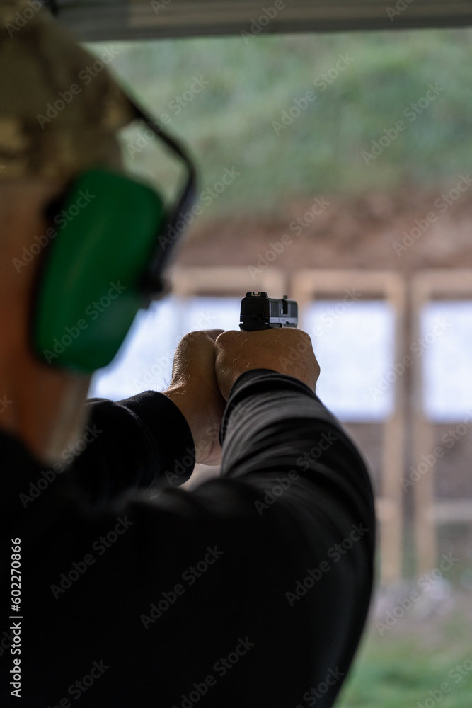 Training shooting weapons at an outdoor shooting range. Stock Photo ...
