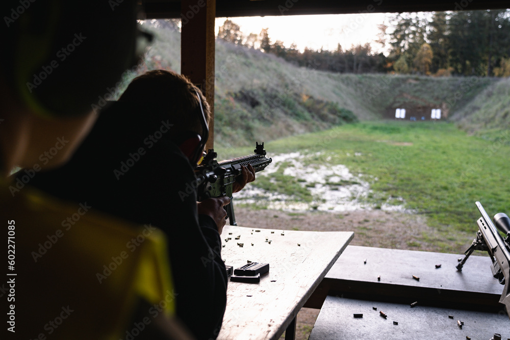 Training shooting weapons at an outdoor shooting range. Stock Photo ...