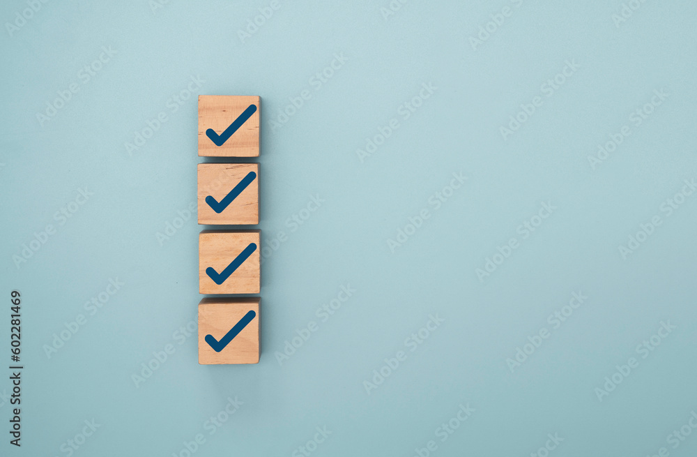 Blue correct sign and tick check mark to wooden cube block with copy ...