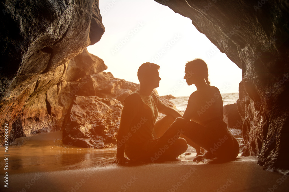 Portrait of happy couple, embracing in the hidden cave at the Querim ...